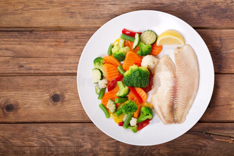 Plate of Fried Fish Fillet with Vegetables, Top View Stock Image ...