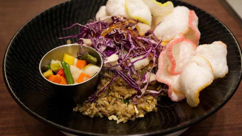 A Plate of Fried Rice with Shrimp Crackers, Purple Cabbage Vegetable ...