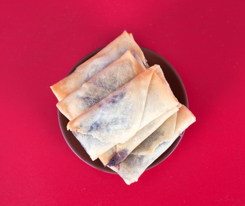 A Plate of Fried Spring Rolls on a Red Festive Background Stock Image ...