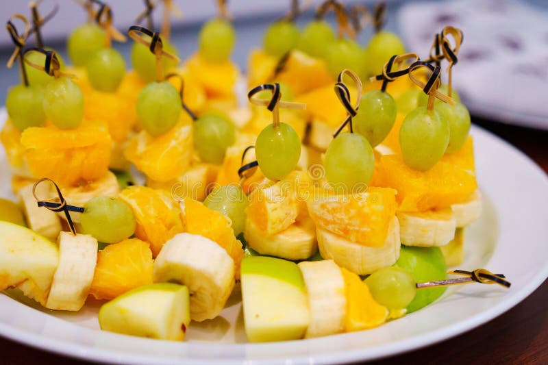 A Plate with Fruity Canapes Made from Apples, Bananas, Oranges and ...