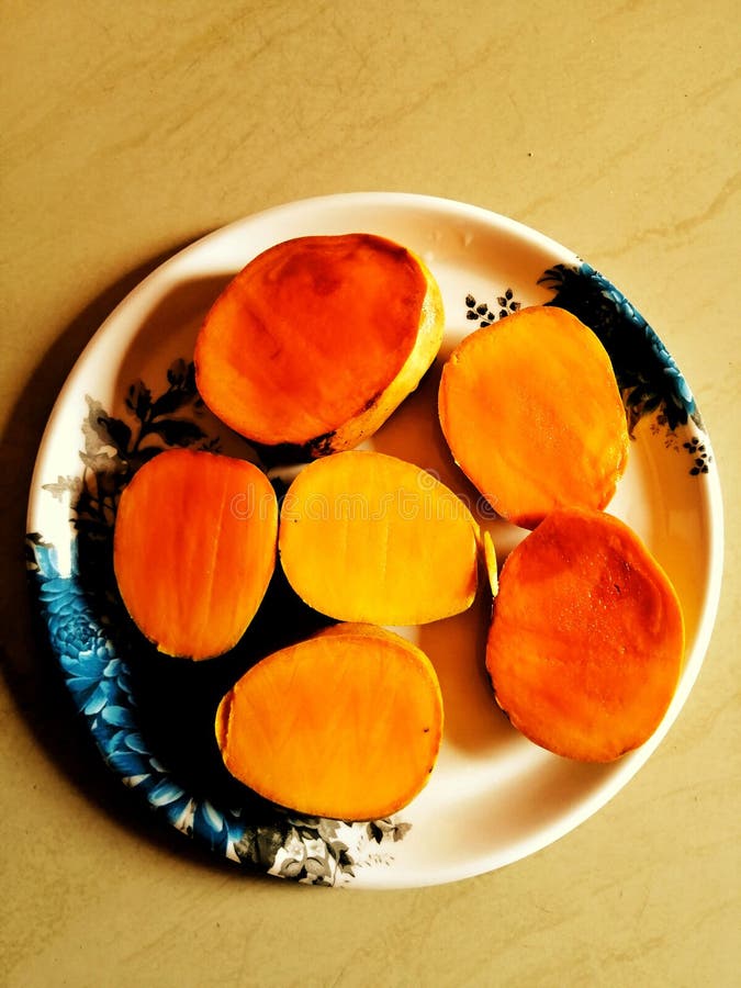 A plate full of mangoes stock photo. Image of fruit - 187161906