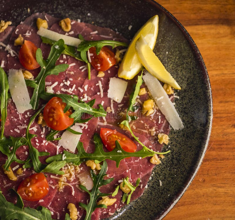 Plate Full of Red Meat with Vegetables Ready To Be Made into a ...