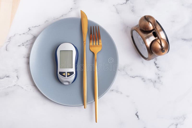 Plate with Glucometer and Cutlery on Plate and Alarm Clock. Diabetes ...