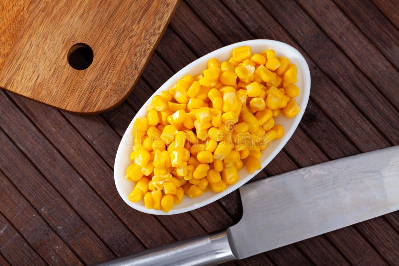 Plate with Grains of Boiled Corn on Wooden Table Stock Image - Image of ...
