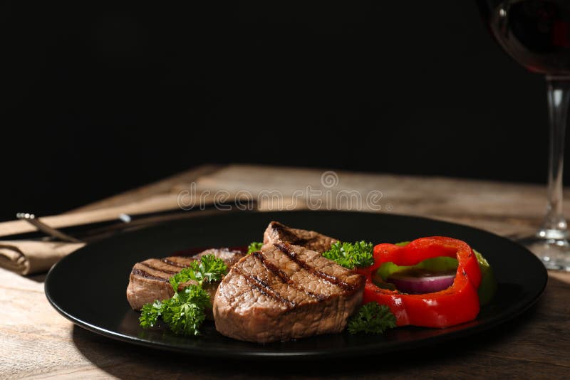 Plate with Grilled Meat and Garnish on Table Stock Image - Image of ...