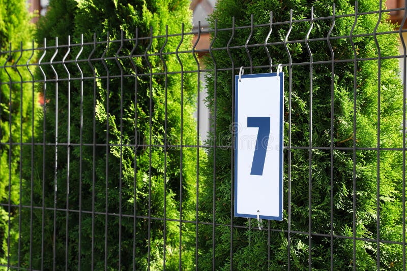 Plate with House Number 7 Hanging on Iron Fence Outdoors Stock Photo ...