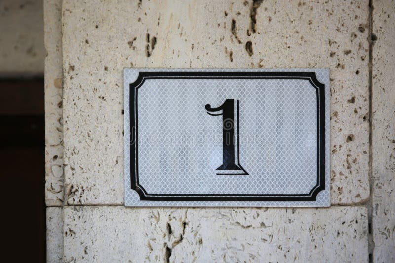 Plate with House Number One Hanging on Beige Old Wall Stock Photo ...