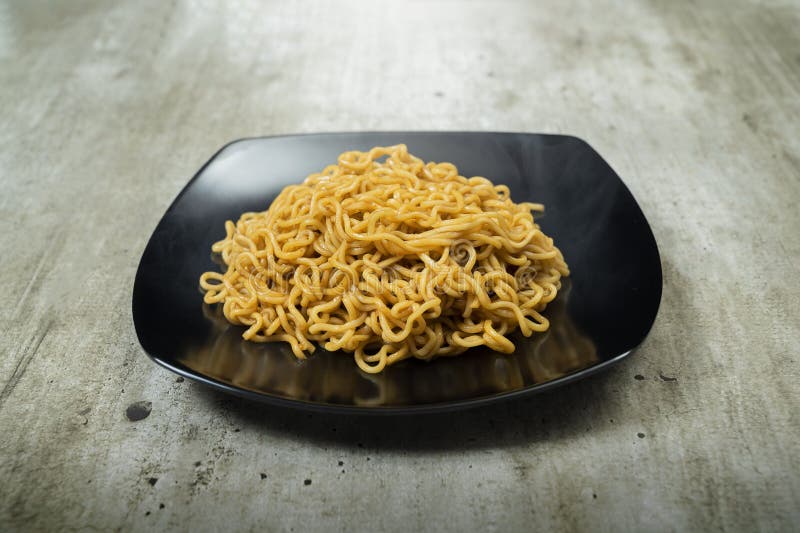 A Plate of Instant Noodles Sits on a Table Stock Image - Image of ...
