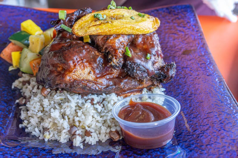 A Plate of Jerk Chicken with Rice and Beans Stock Photo - Image of ...