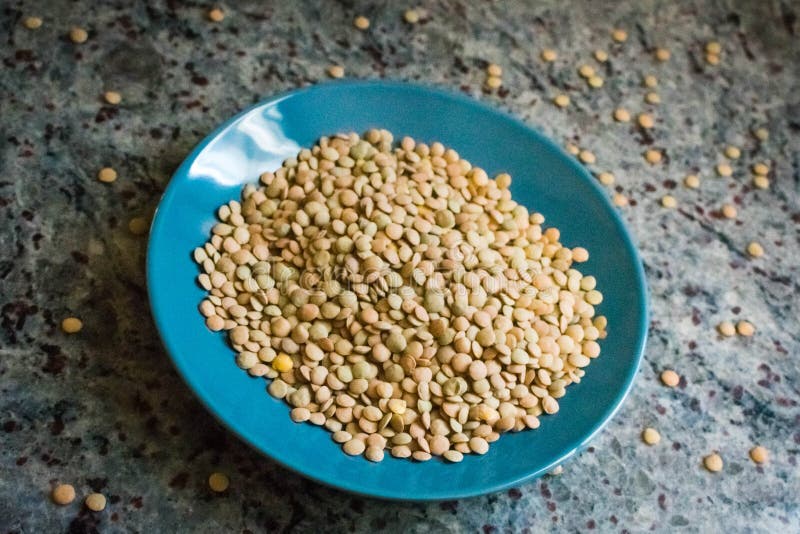 A Plate of Lentils without Cooking Stock Image - Image of green ...