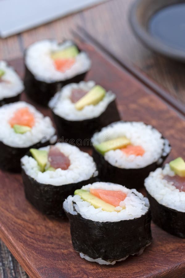 Plate of maki on a table stock image. Image of table - 217602049