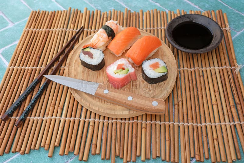 Plate of maki on a table stock image. Image of isolated - 217797853