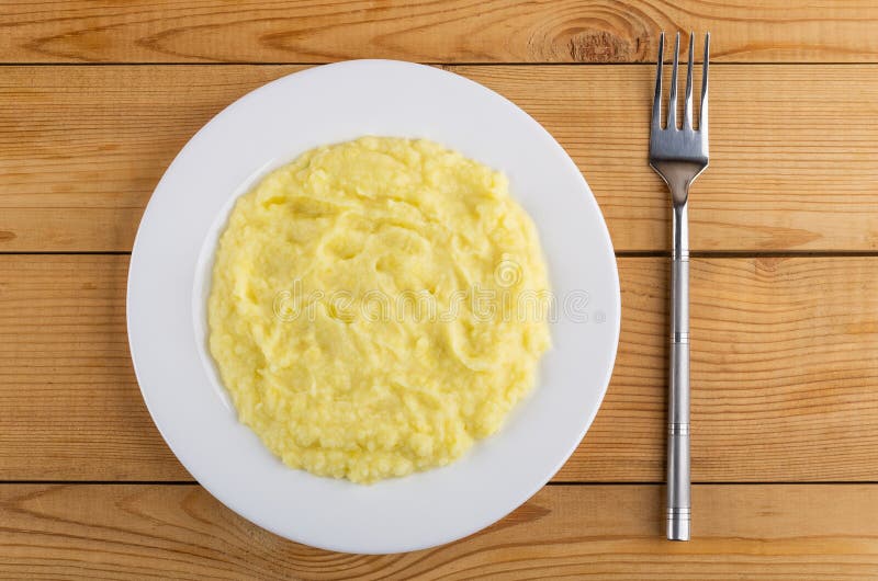 Plate with Mashed Potato, Fork on Table. Top View Stock Image - Image ...