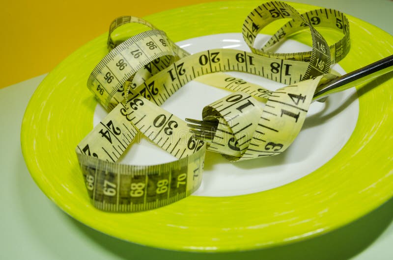 A Plate with Measuring Tape Stock Photo - Image of heart, dieting ...