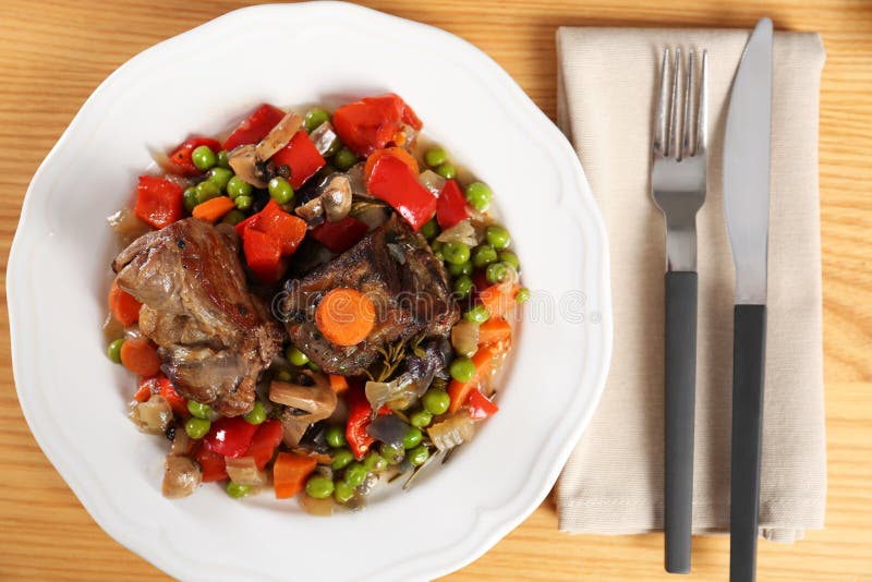 Plate with Meat and Garnish Prepared in Multi Cooker on Table Stock ...