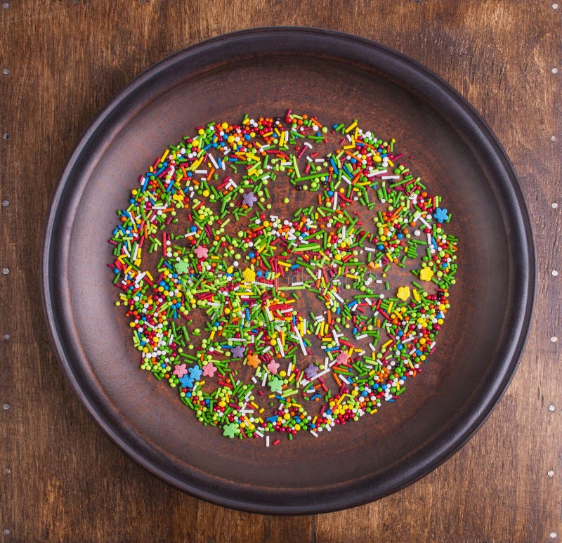 Plate with Mini Sweet Sprinkles on Table Stock Image - Image of dessert ...