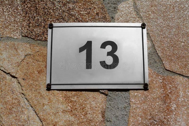 Plate with Number 13 on Textured Stone Wall, Closeup Stock Image ...