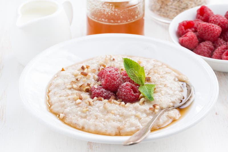 Plate of Oatmeal with Fresh Raspberries and Honey, Close-up Stock Image ...
