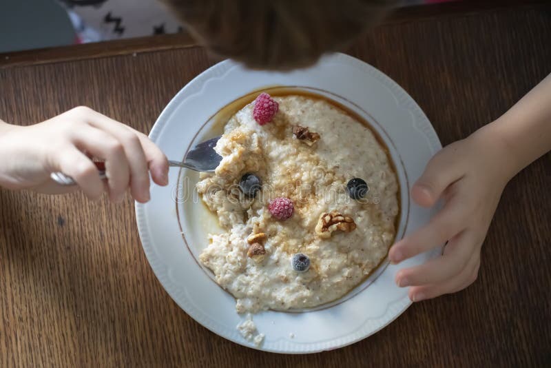 Plate with oatmeal stock photo. Image of fruit, indoors - 230429978