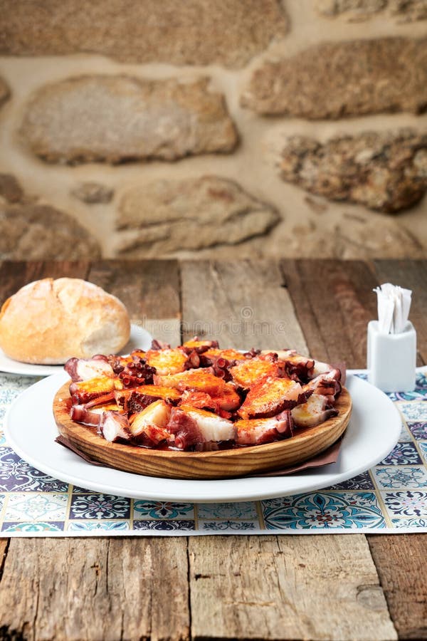 Plate with Octopus and a Piece of Bread, Vertical Image Stock Image ...