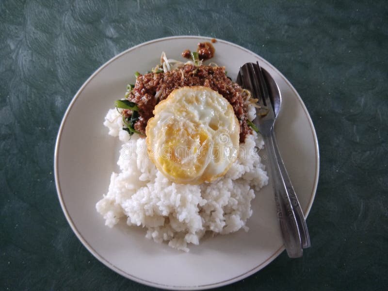A Plate of Pecel Rice with Cutlery on the Table Stock Photo - Image of ...