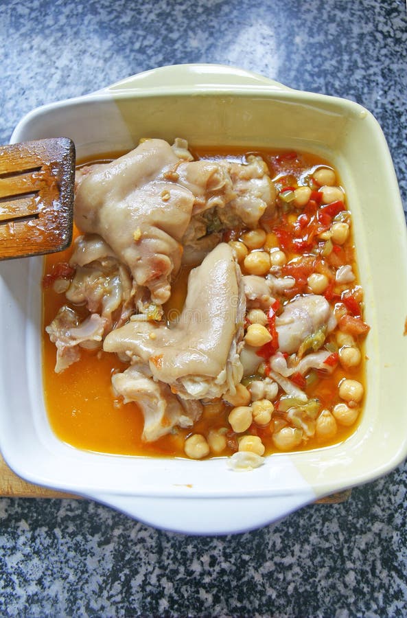 Plate of Pig Trotters with Chickpeas Stock Photo - Image of tomato ...