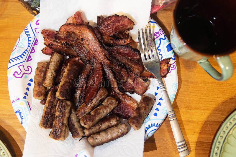 Plate Piled High with Bacon and Sausage for Breakfast Stock Photo ...