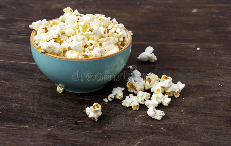A Plate of Popcorn on a Brown Table , Top View. Stock Image - Image of ...