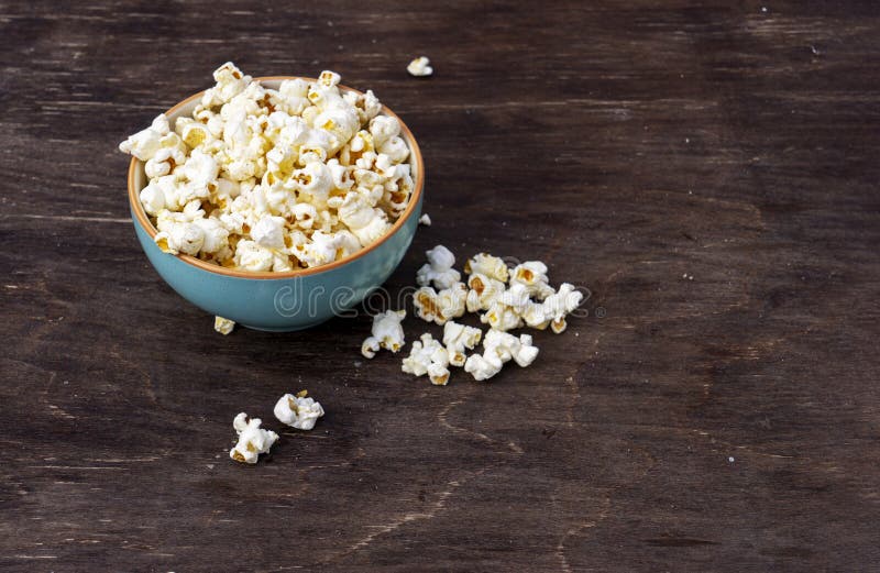 A Plate of Popcorn on a Brown Table , Top View. Stock Photo - Image of ...