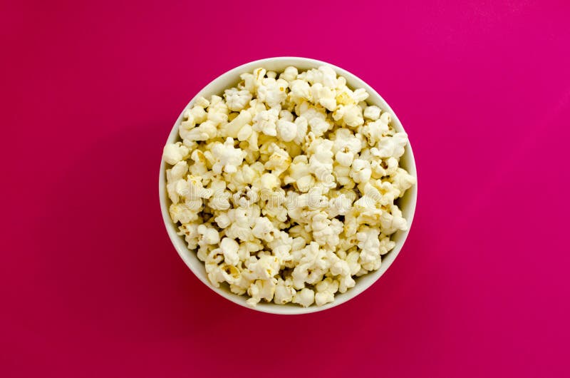 Plate with Popcorn on Yellow and Red Background. Layout. Top View Stock ...