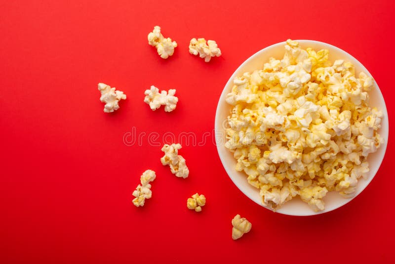 Plate with Popcorn on a Red Bright Background. Movie Viewing Concept ...
