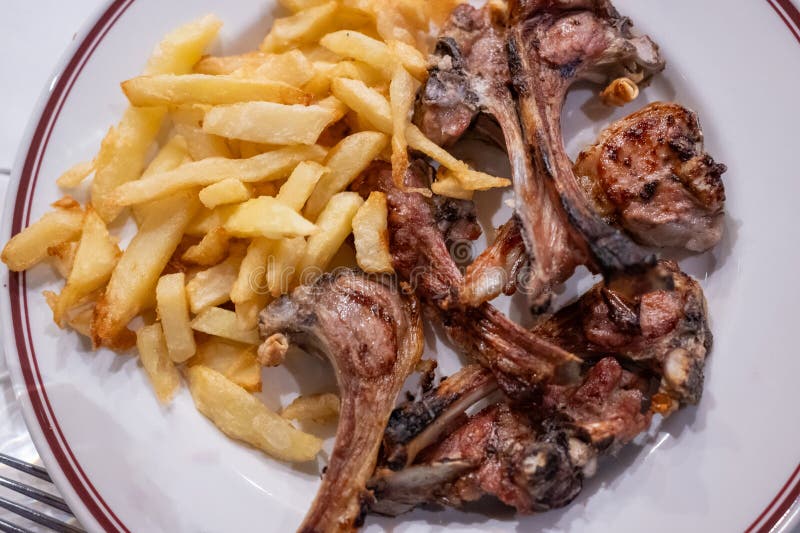Plate and Portion of Lamb Chops, Young Lamb, Grilled with Chips ...