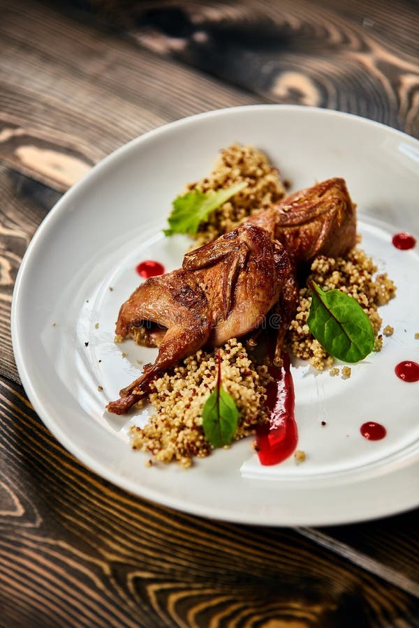 A Plate of Quinoa Quail on a Table Stock Image - Image of abstract ...