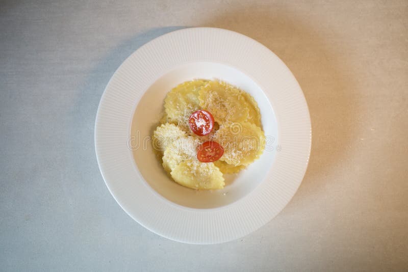 A Plate of Ravioli Placed on the Side of a Table. Stock Image - Image ...