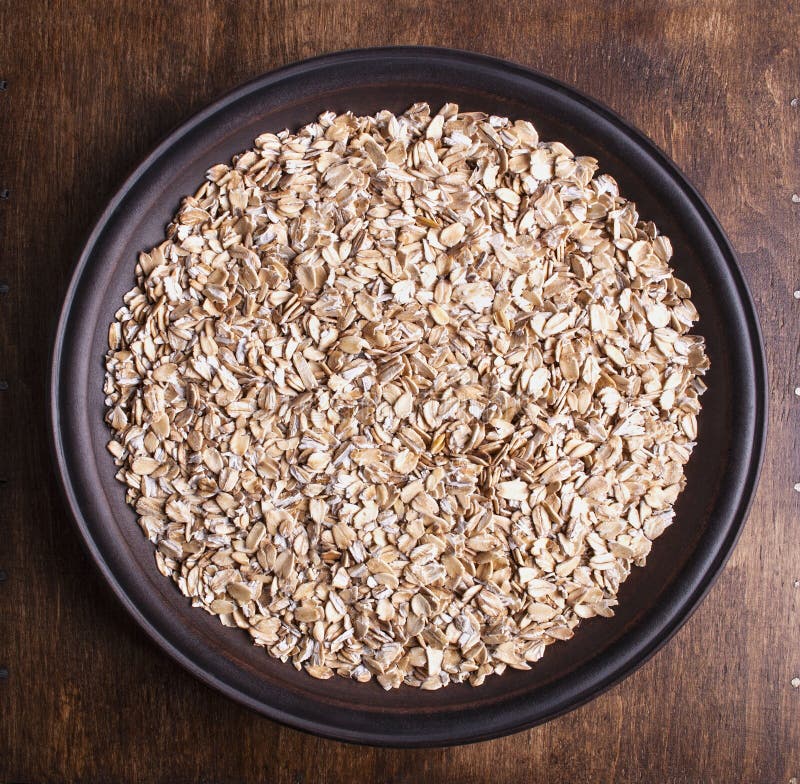Plate with Raw Oatmeal on Table Stock Photo - Image of organic ...