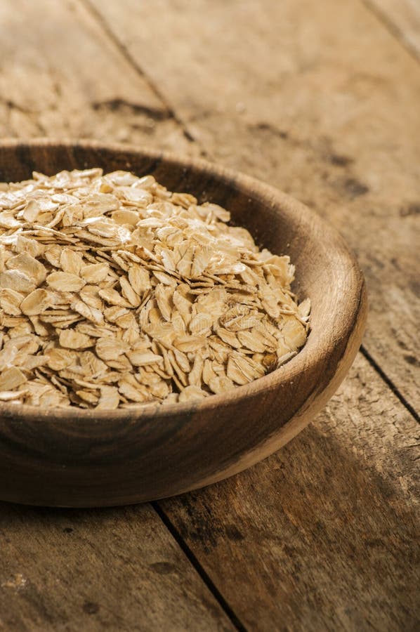 Plate With Raw Oatmeal On Wooden Table. Stock Photo - Image of bowl ...