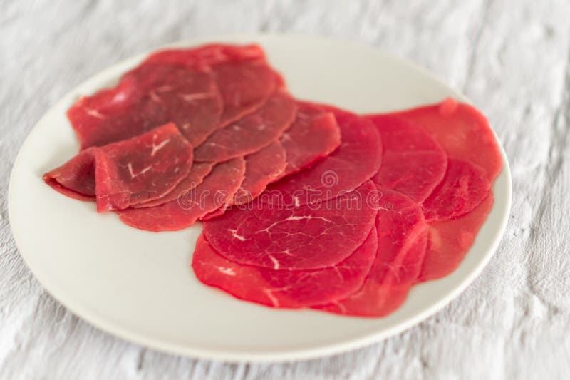 A Plate of Red Meat with a White Background Stock Photo - Image of ...