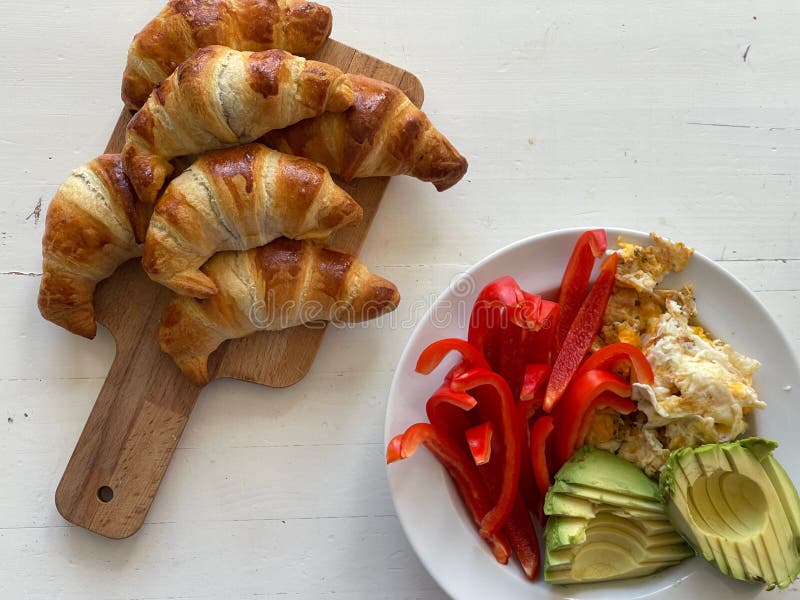 Plate with Red Pepper, Avocado, Scrambled Eggs, and Croissants on the ...