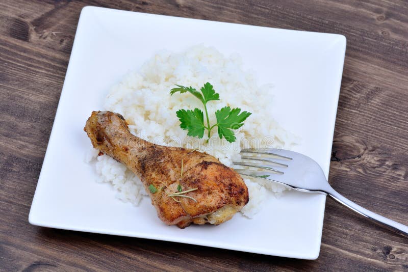 Plate with Rice and Chicken Leg on Table Stock Photo - Image of chicken ...