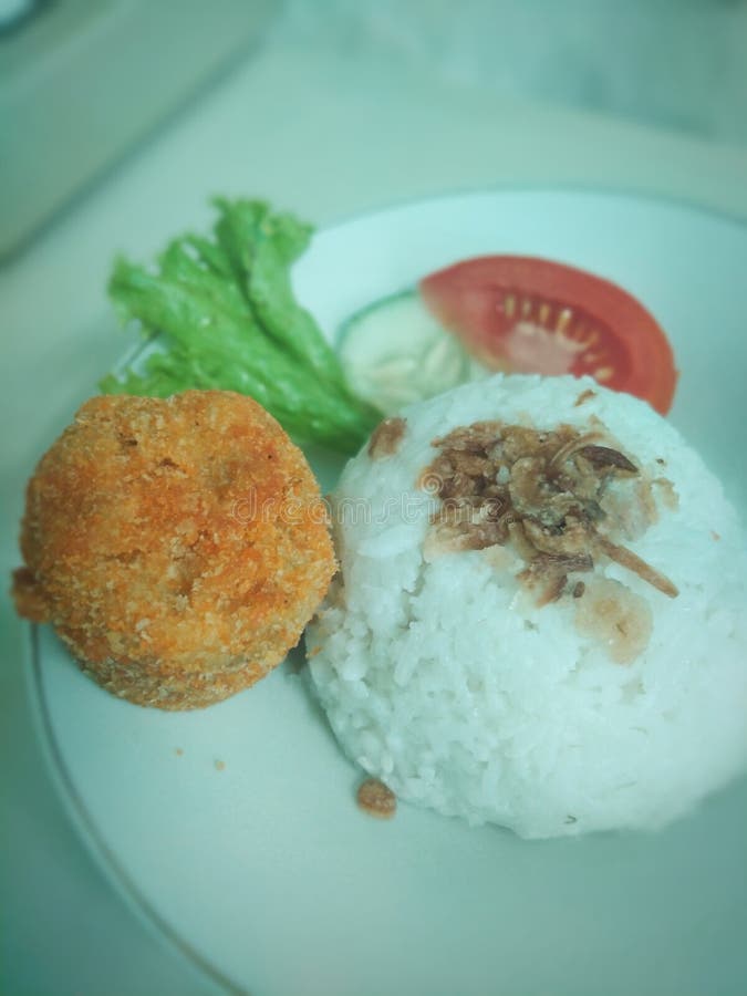 A Plate of Rice with Chicken Nugget and Little Vegetables Stock Photo ...