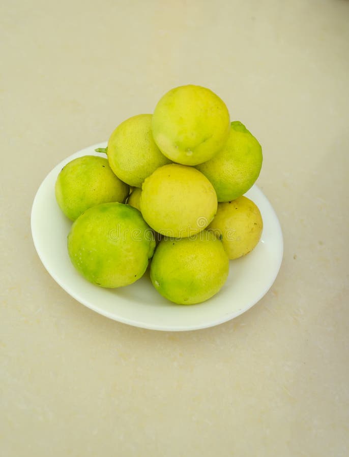 Plate of Ripe Limes stock photo. Image of acidic, aromatic - 144552320