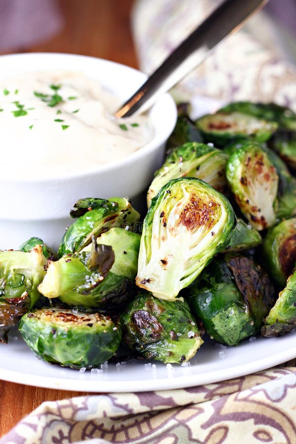 Roasted Brussels sprouts stock photo. Image of dining - 340305052