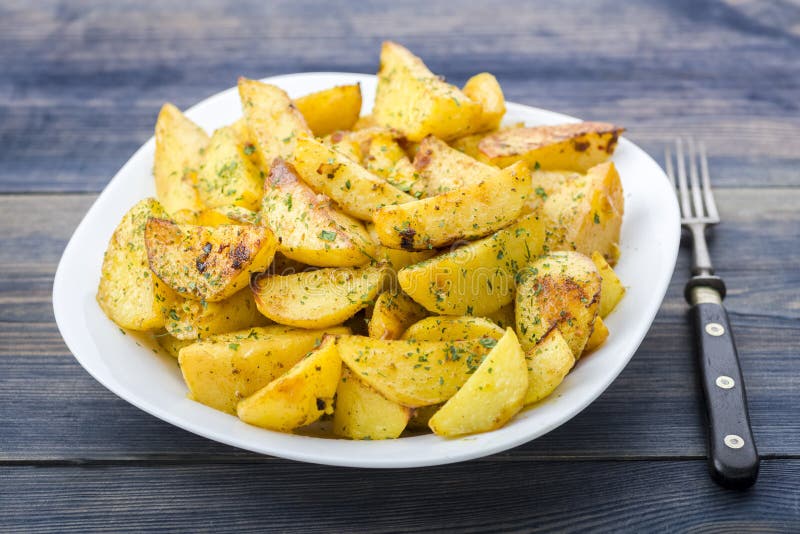Plate with Roasted Potatoes Stock Photo - Image of plate, onion: 107241604