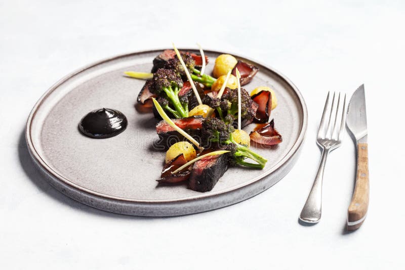 Seared Beef with Purple Sprouting Broccoli Stock Photo - Image of meat ...