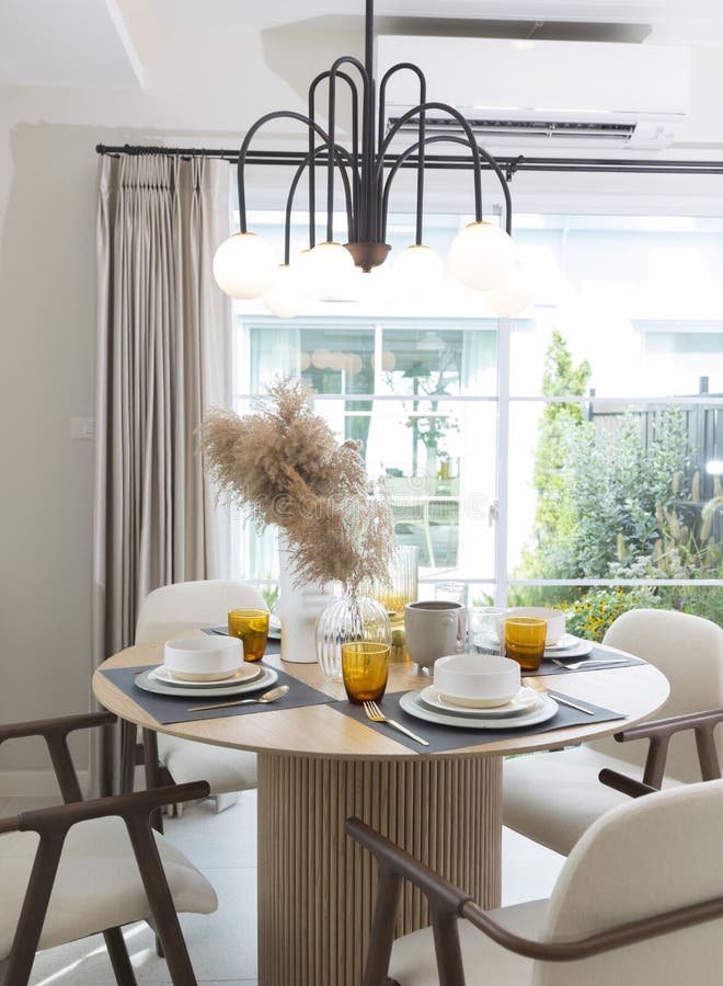 Plate Setting on Round Table in Modern Style Dining Room Interior of ...