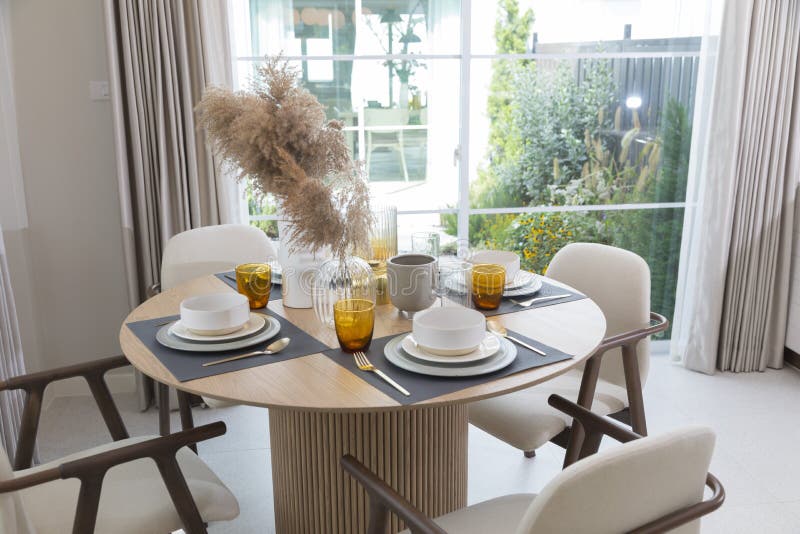 Plate Setting on Round Table in Modern Style Dining Room Interior of ...