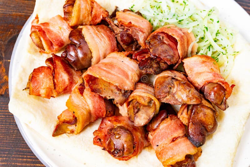 Bacon-wrapped Dish with Fresh Garnishes Served at Restaurant Stock ...