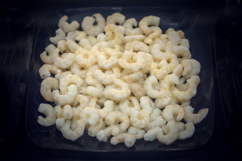 A Plate of Shrimp is Sitting on a Counter. Stock Photo - Image of ...