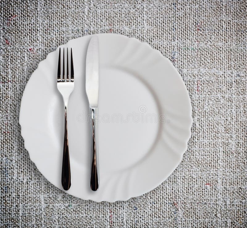 Plate with silverware stock photo. Image of knife, brown - 26571966