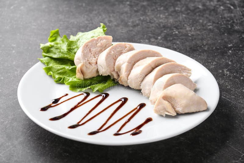 Sliced Boiled Chicken Fillet with Herbs and Spices on Wooden Board ...